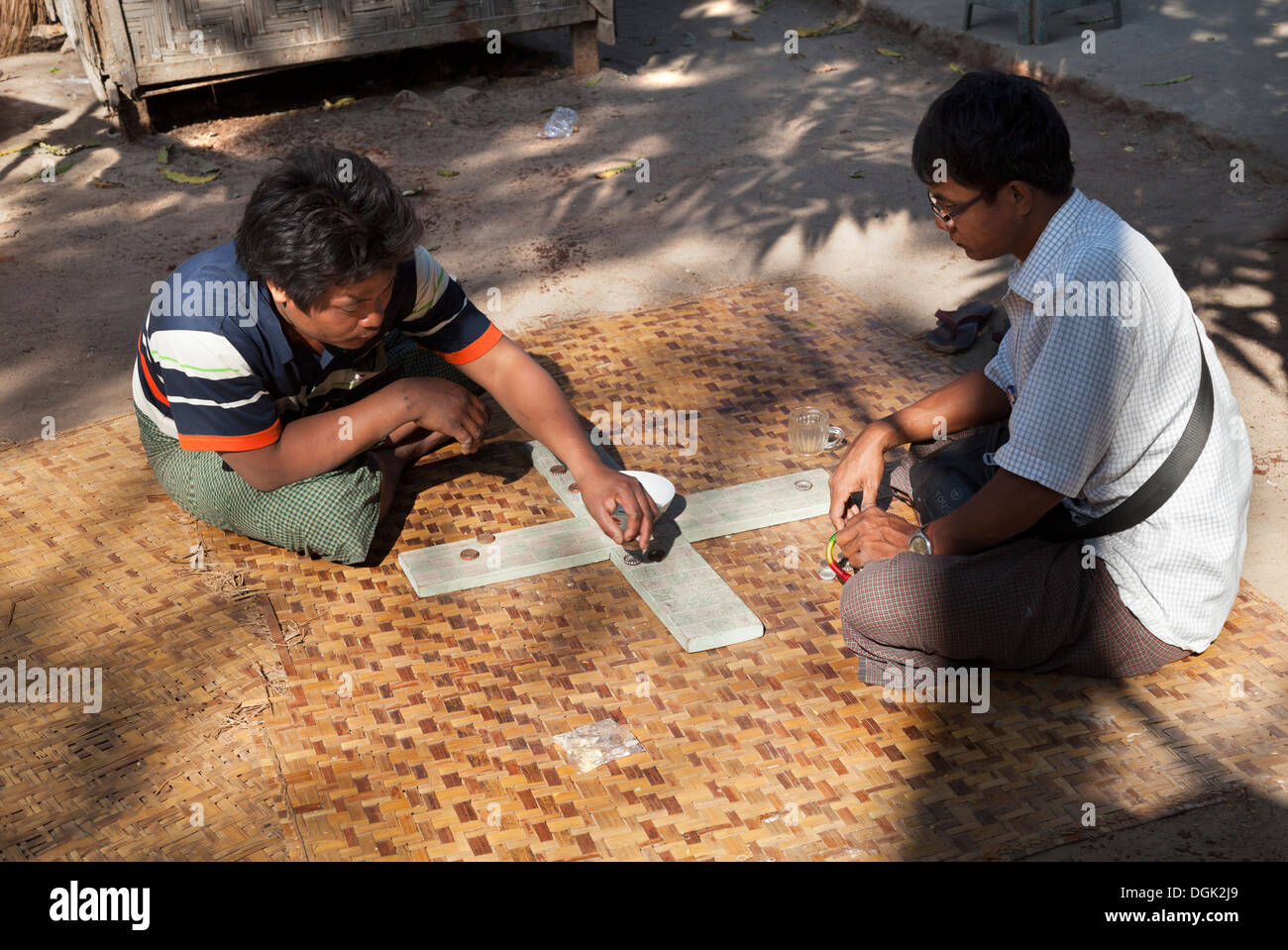 An unusual board game being played in the street in Mandalay in Myanmar ...