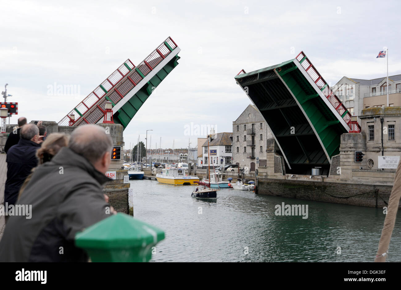 Yacht passes under the bridge in Weymouth harbour Dorset Wessex UK ...