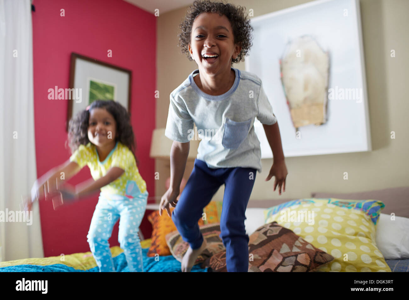 Children jumping on bed Stock Photo - Alamy