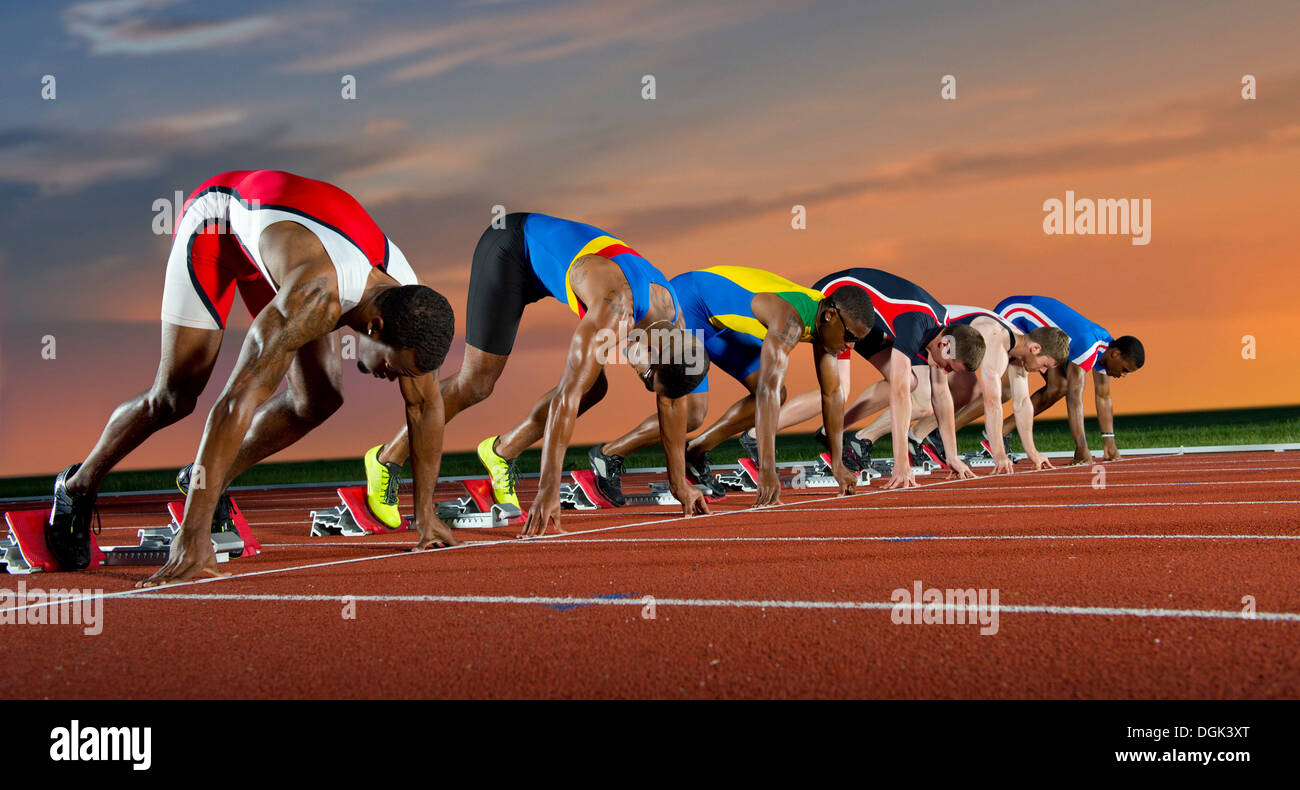 Six athletes starting race Stock Photo - Alamy
