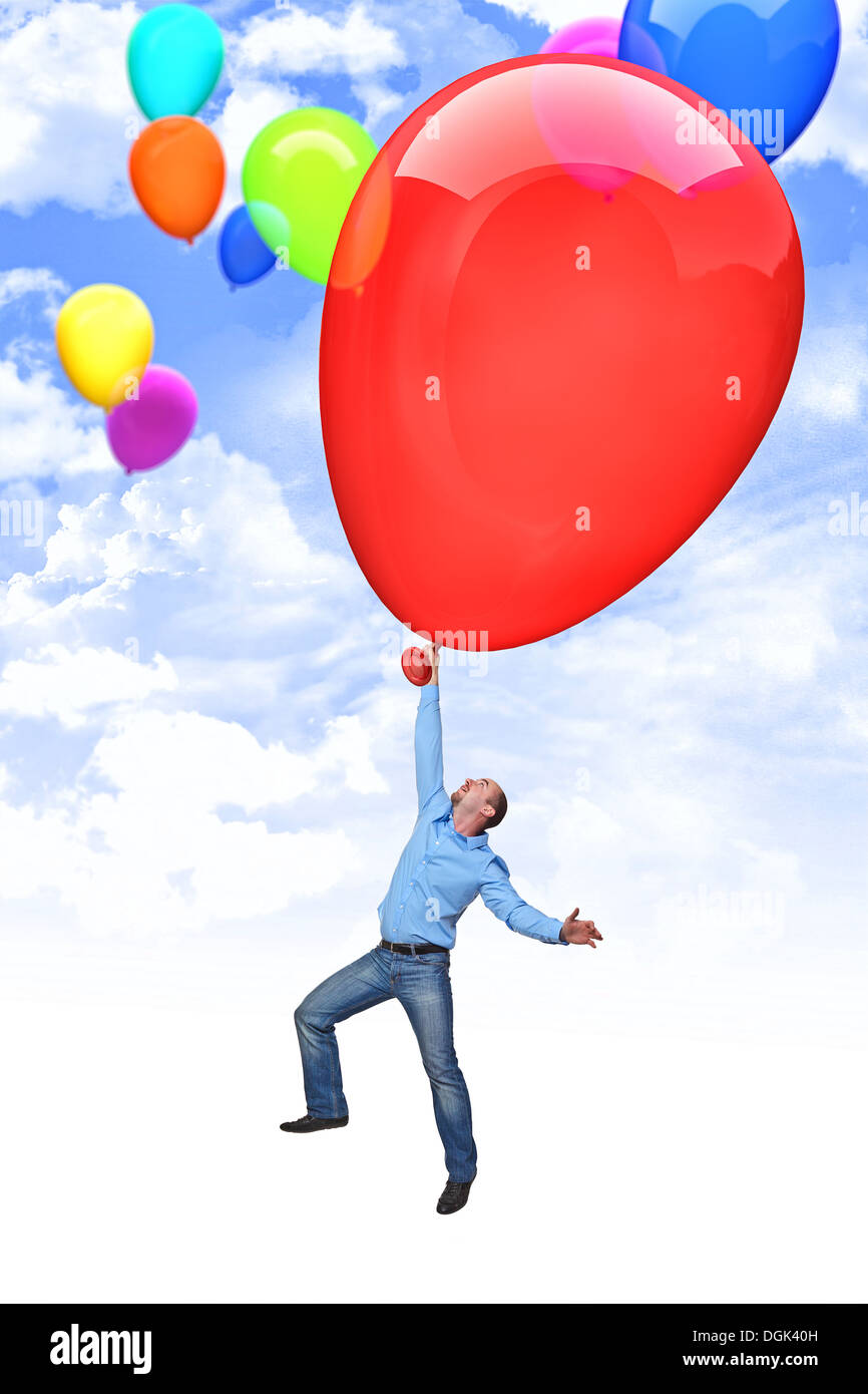 Man flying balloon hi-res stock photography and images - Alamy