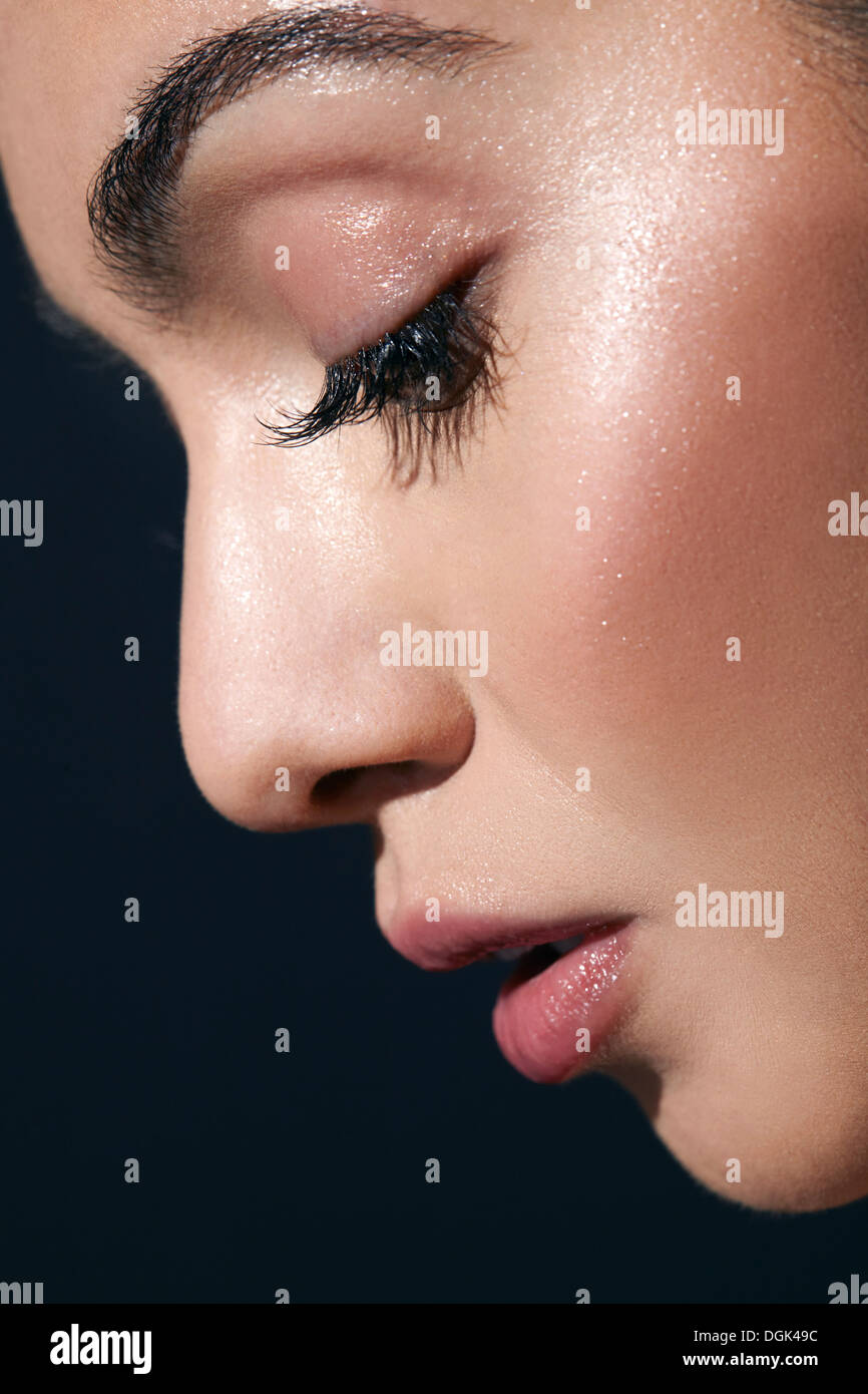 Woman looking down Stock Photo - Alamy