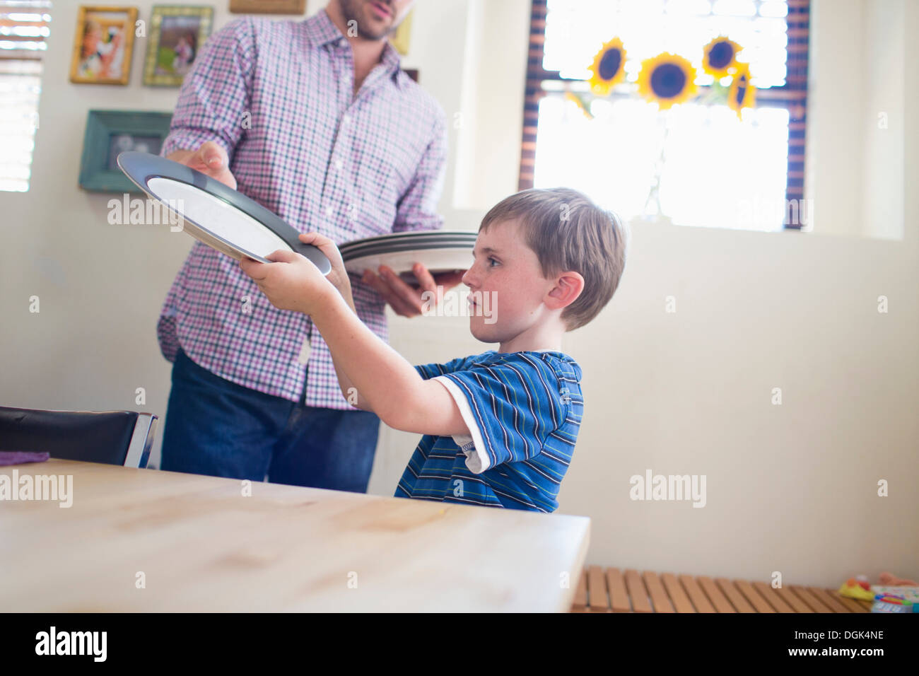 Boy setting table hi-res stock photography and images - Alamy