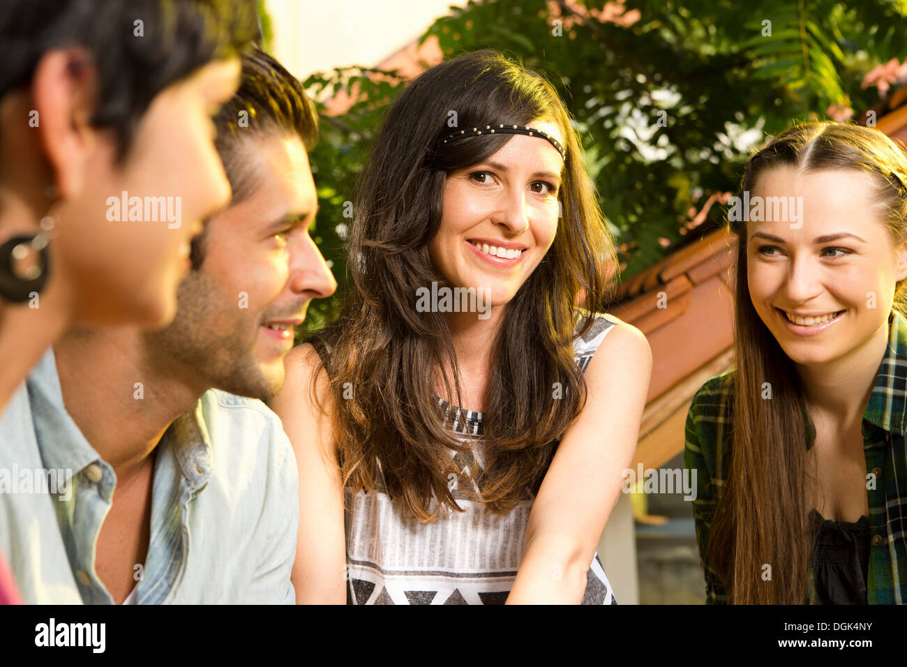 Four people smiling hi-res stock photography and images - Alamy