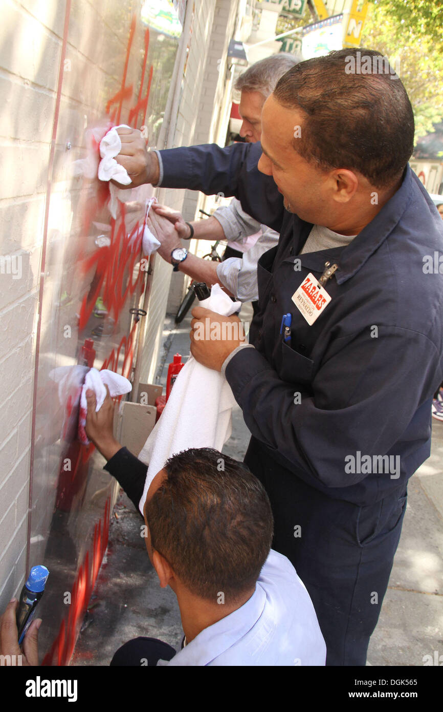New York, New York, USA. 21st Oct, 2013. Maintenance workers remove the ...