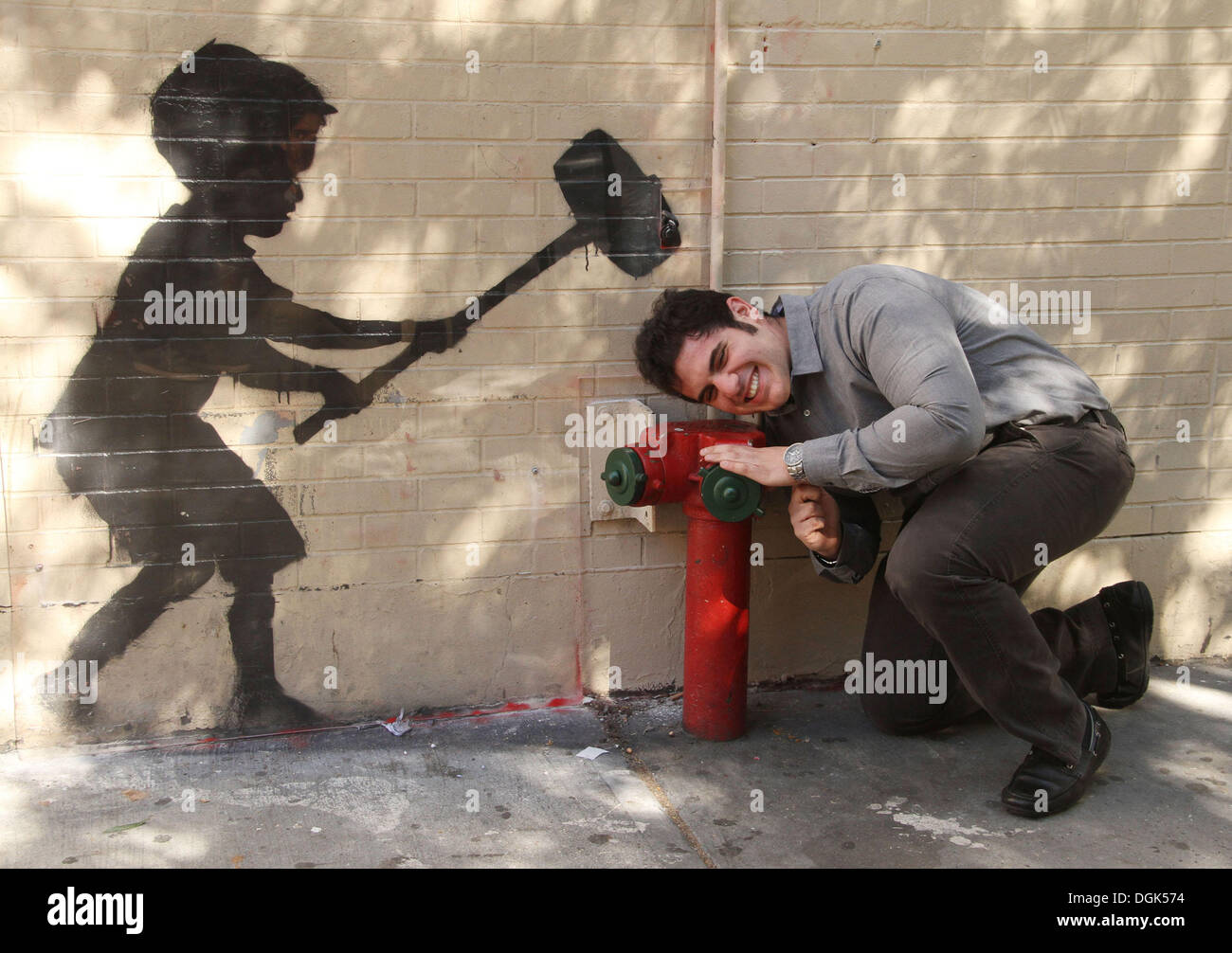 New York, New York, USA. 21st Oct, 2013. A man poses in front of ...