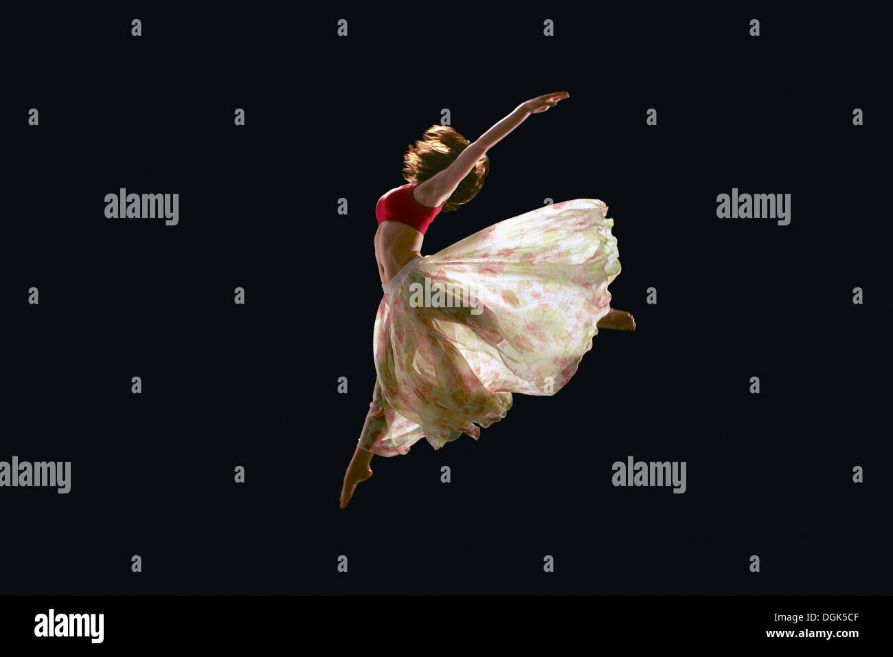 Dancer in midair wearing tutu Stock Photo - Alamy