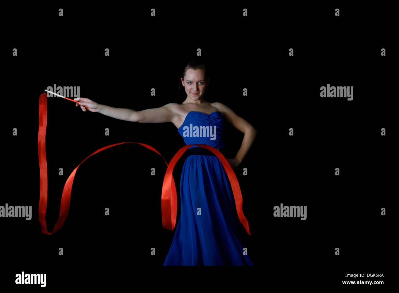 Dancer with ribbon on black background Stock Photo - Alamy
