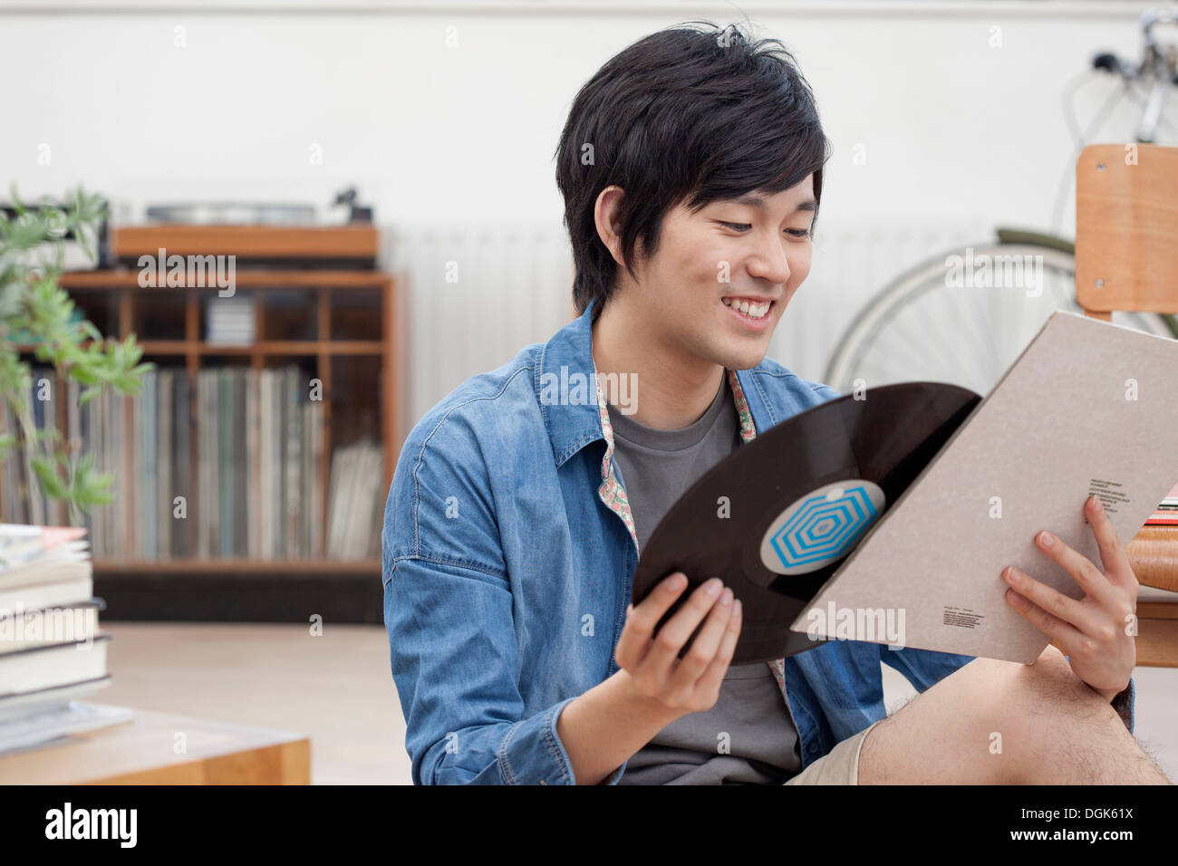 Man sitting on record collection hi-res stock photography and images ...