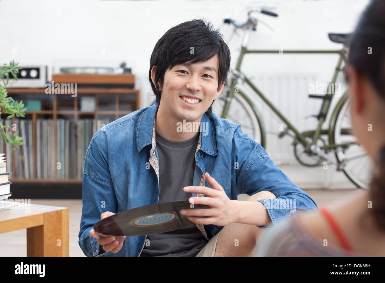 Man sitting on record collection hi-res stock photography and images ...