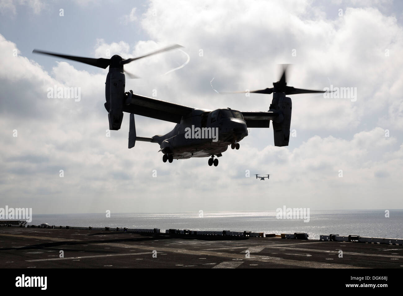 An MV-22 Osprey from Marine Medium Tiltrotor Squadron (VMM) 266 (Reinforced) lands on the flight ...