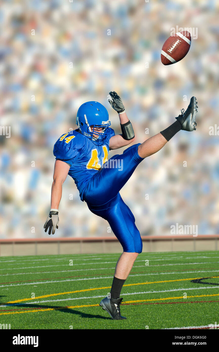 Footballer kicking ball on white hi-res stock photography and images ...