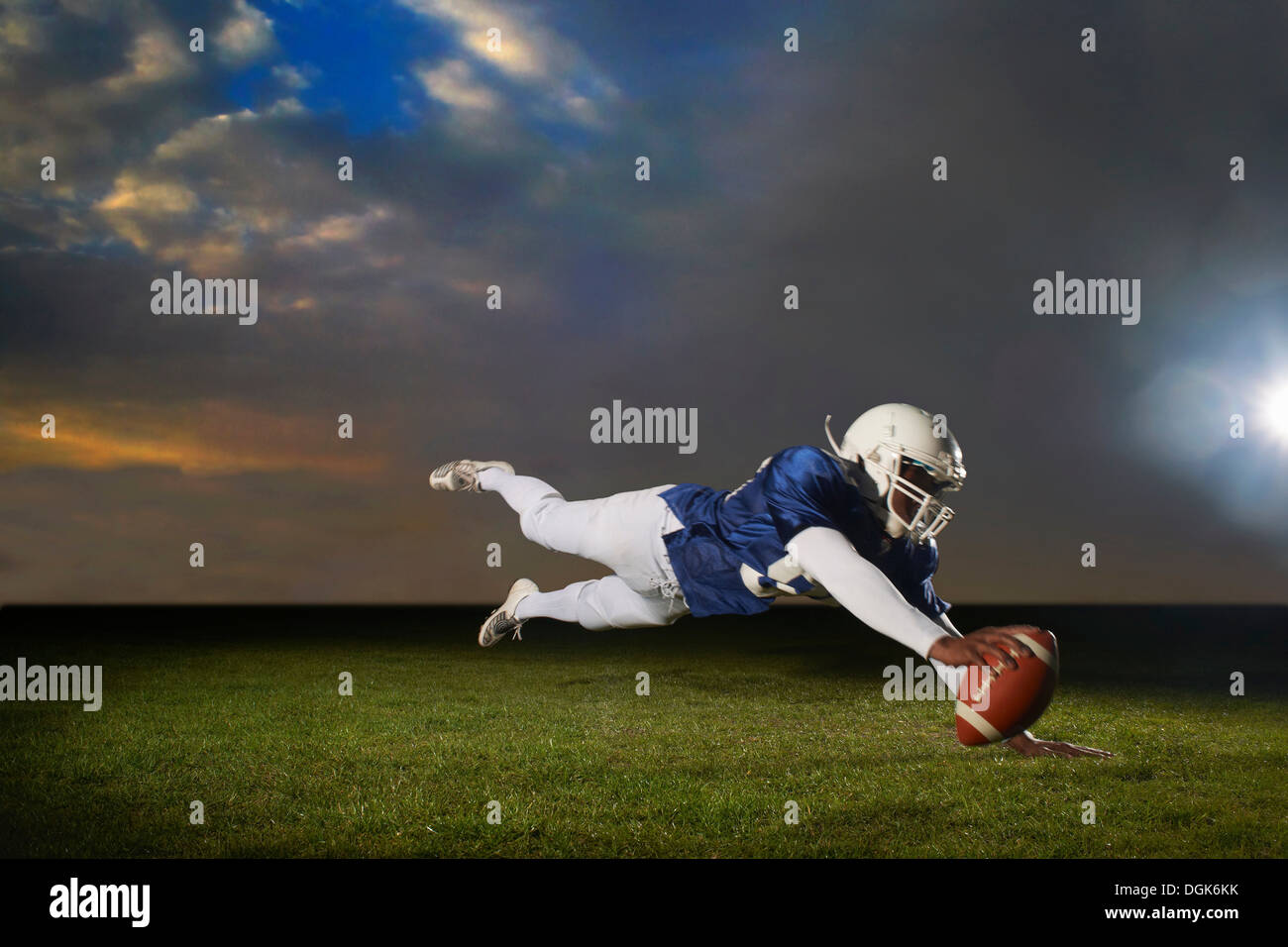 American football player reaching for touch down Stock Photo - Alamy