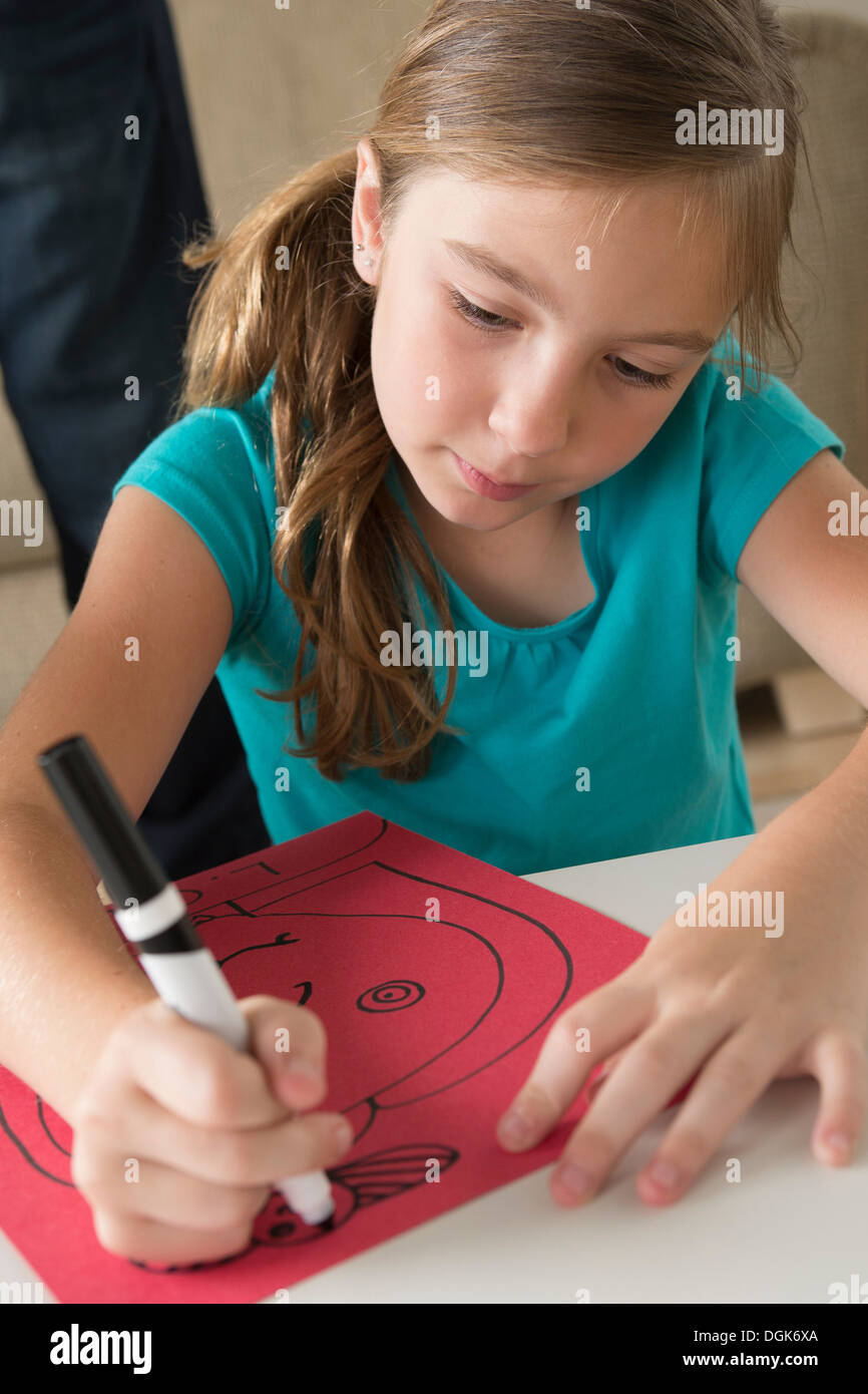 Girl drawing picture Stock Photo - Alamy