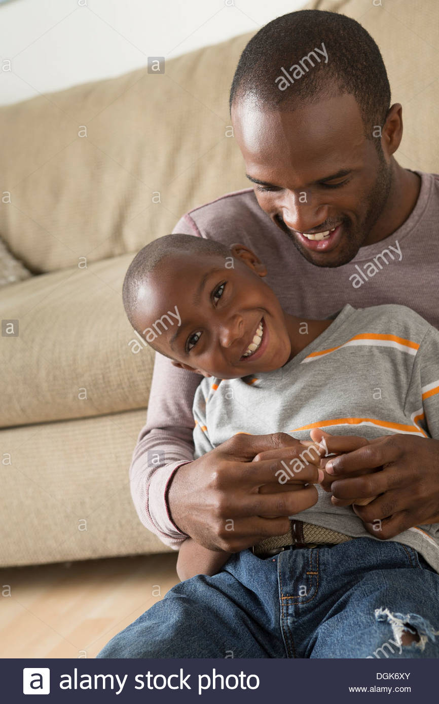 Boy Sitting On Fathers Lap Stock Photos & Boy Sitting On Fathers Lap ...