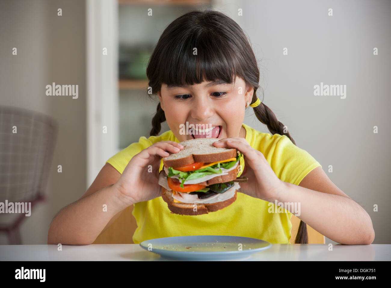 Girl biting into sandwich Stock Photo - Alamy Girl biting into sandwich Stock Photo - Alamy