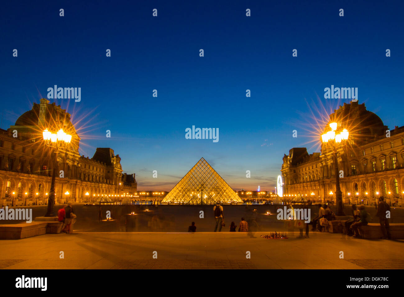 Pyramid of Louvre Museum at dusk in Paris France Stock Photo - Alamy
