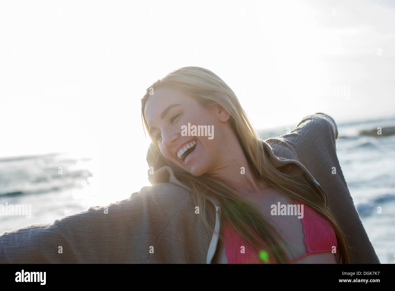 Woman flinging arms wide open in happiness Stock Photo - Alamy