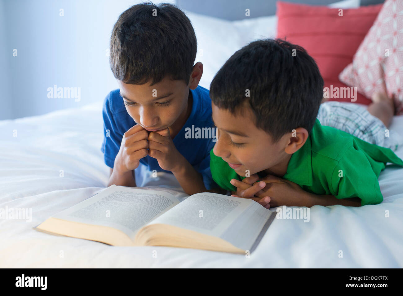 Brothers reading on bed Stock Photo - Alamy