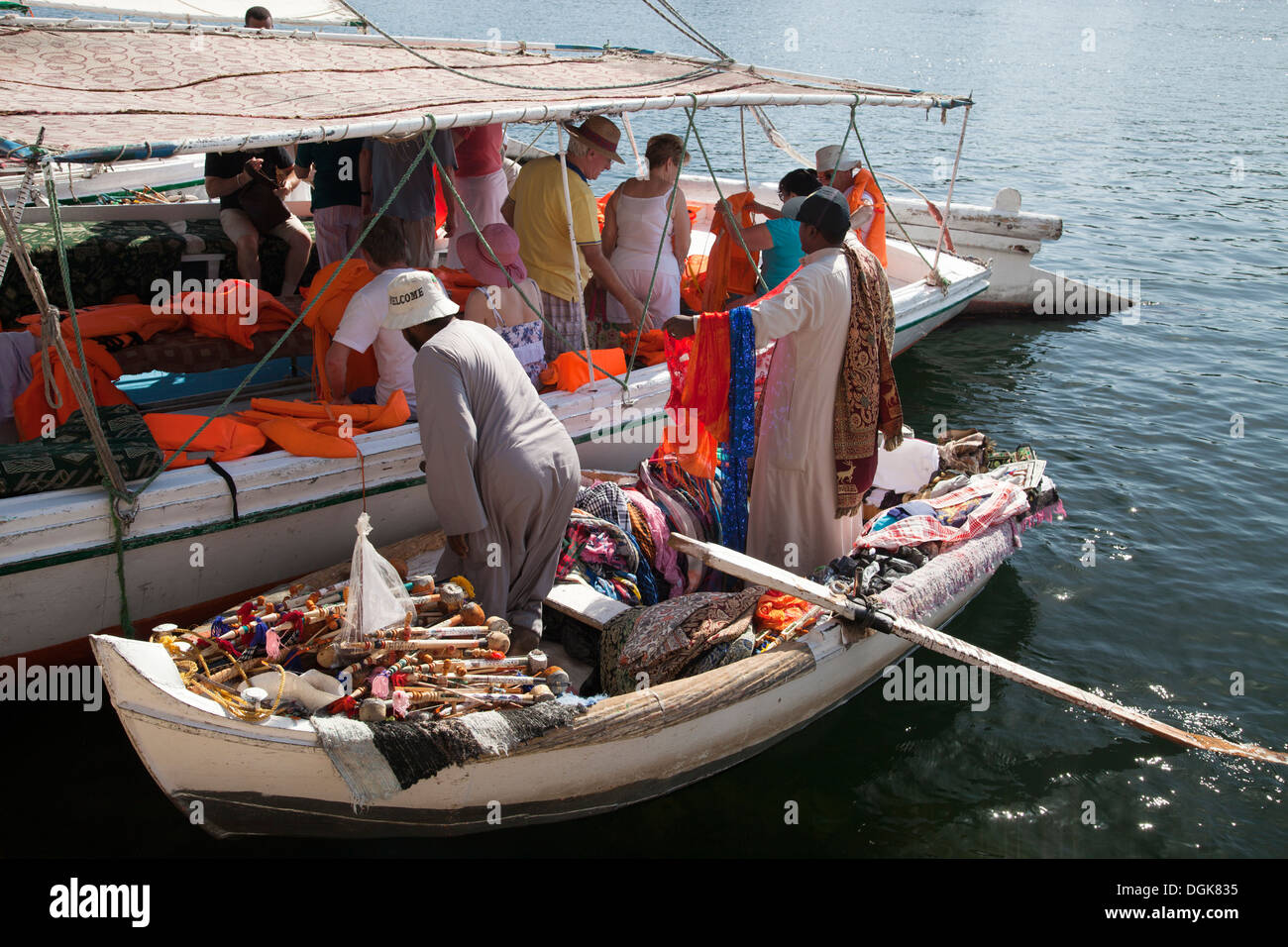 Boat to boat salesman selling souvenirs on The Nile Stock Photo - Alamy
