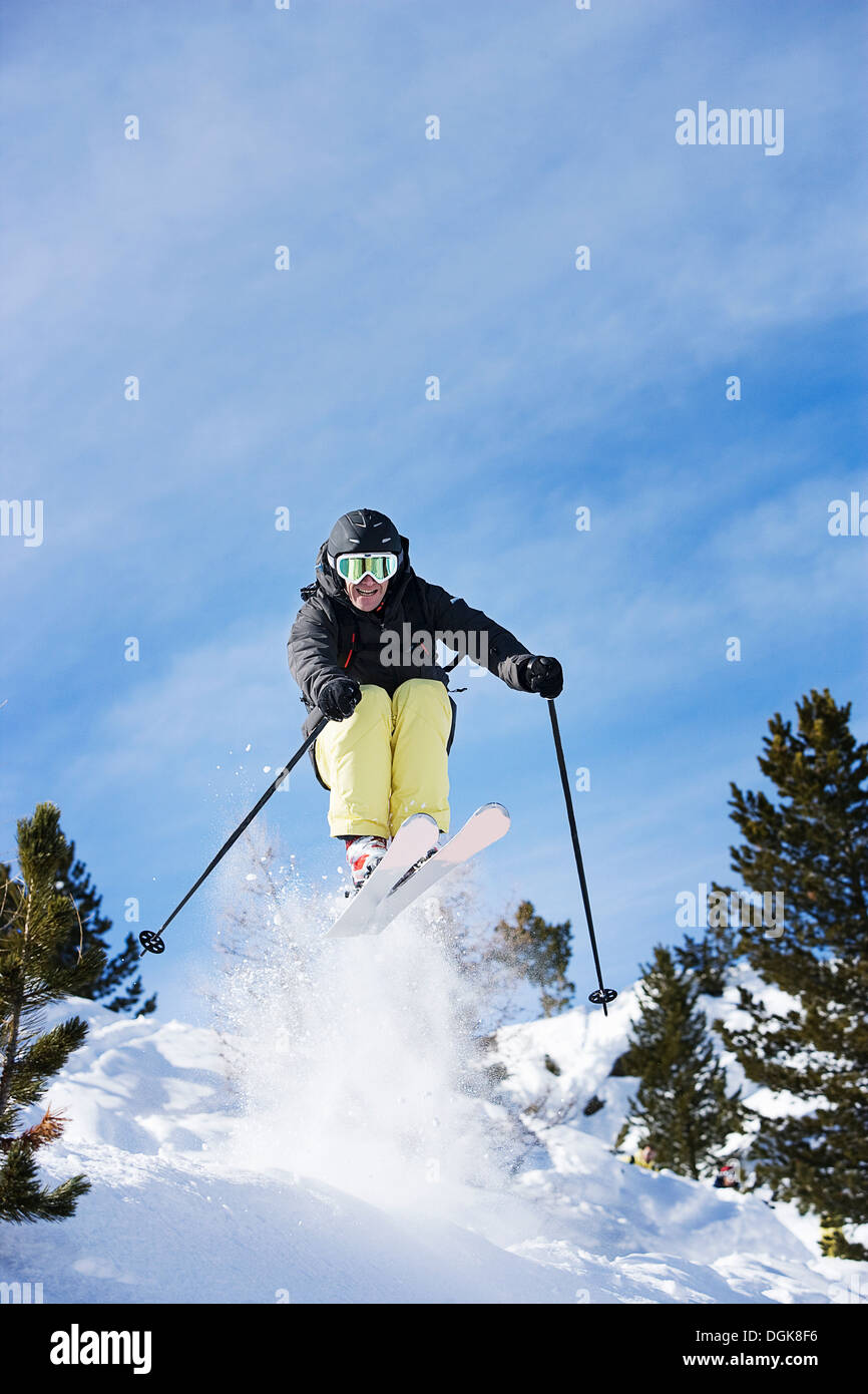 Male skier mid air on mountainside Stock Photo - Alamy