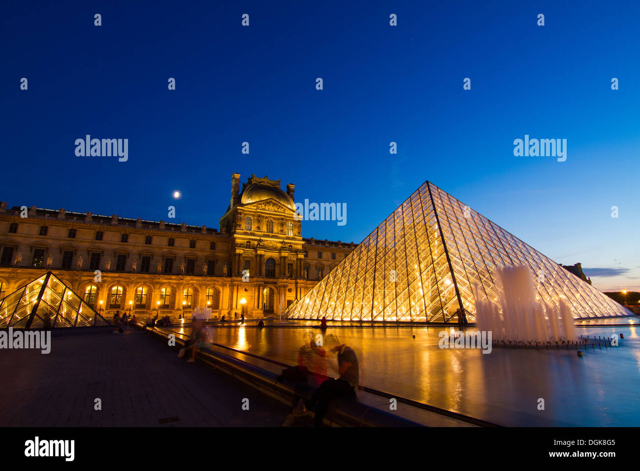 Pyramid of Louvre Museum at dusk in Paris France with the fool moon in ...