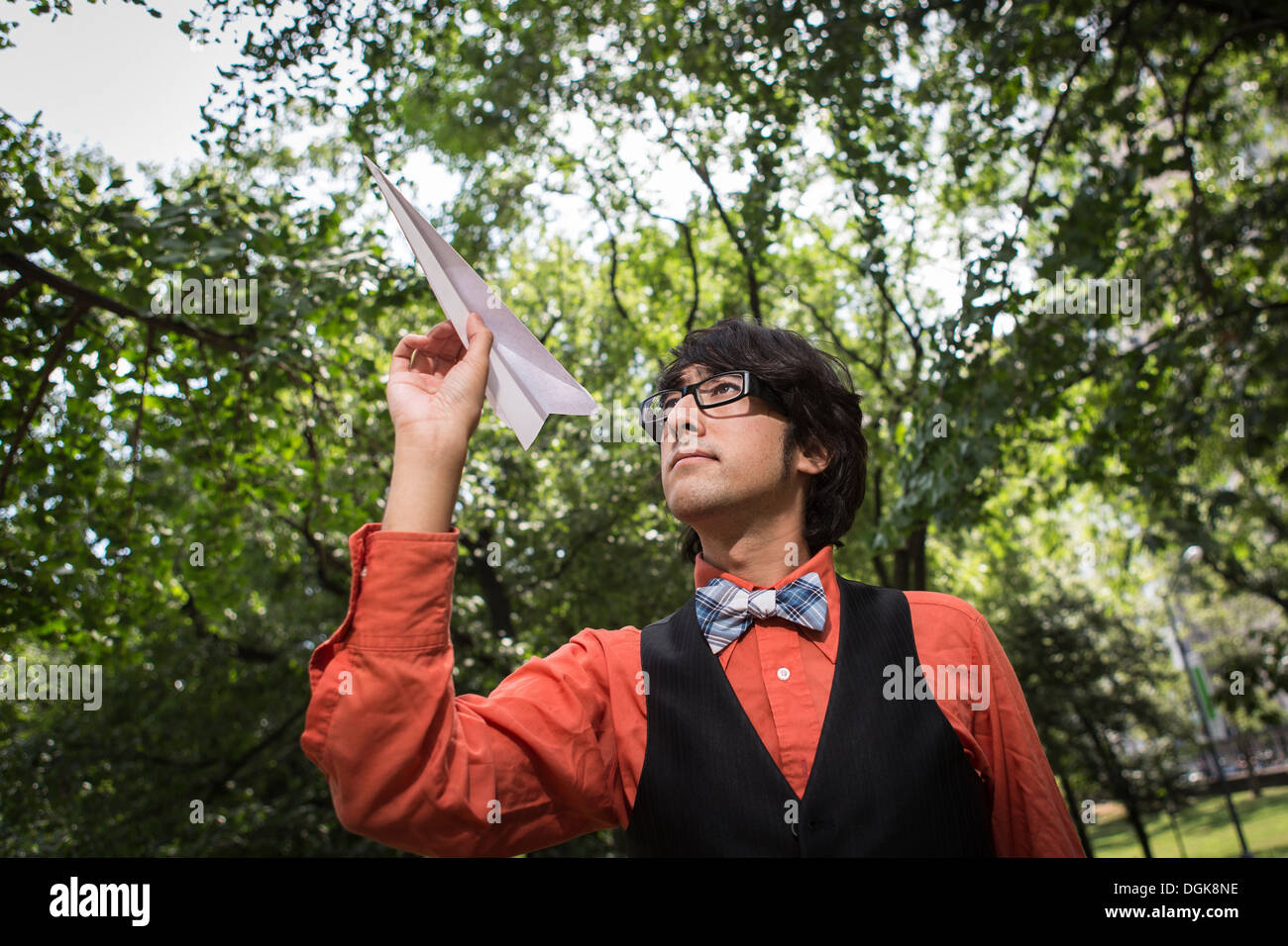 Man throwing paper plane Stock Photo - Alamy