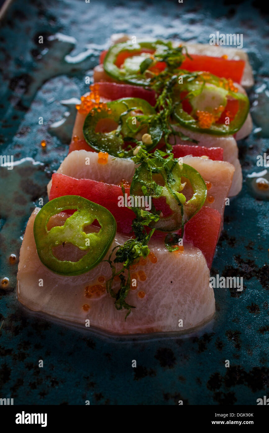 Hawaiian dish with green chilli and garnish Stock Photo - Alamy