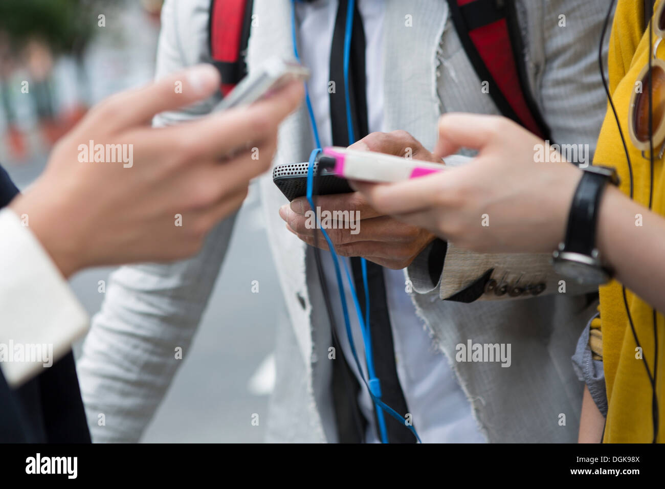 Close up of hands holding mp3 player Stock Photo - Alamy