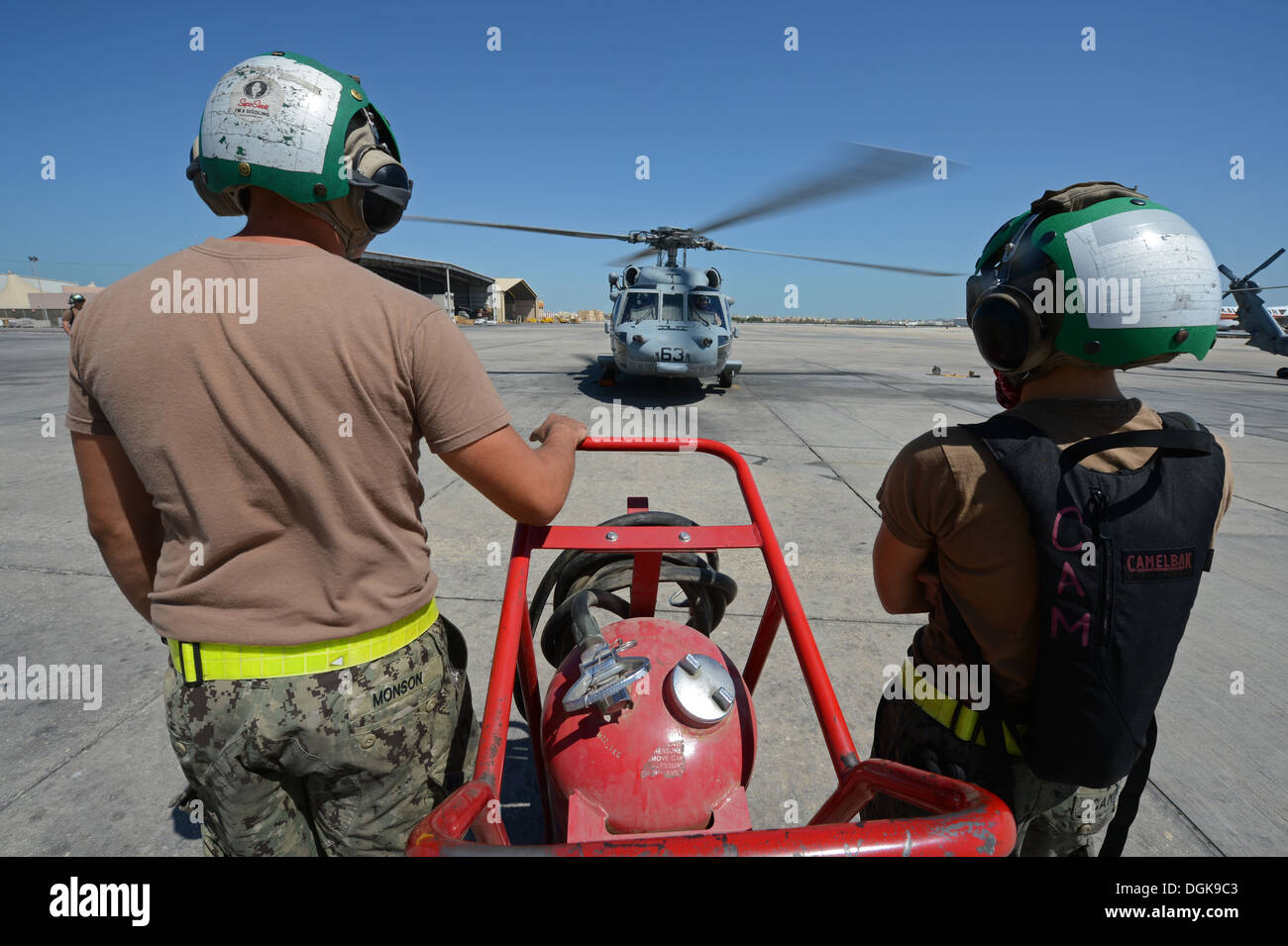 Two Sailors assigned to Helicopter Sea Combat Squadron (HSC) 26 ...
