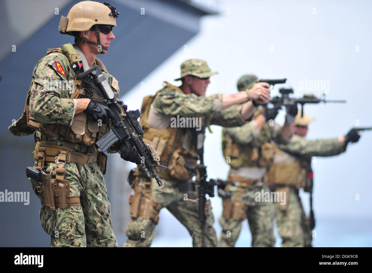 Members assigned to Explosive Ordnance Disposal Mobile Unit (EODMU) 5 ...