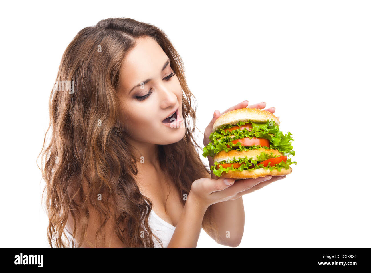 Happy Young Woman Eating big yummy Burger isolated Stock Photo - Alamy