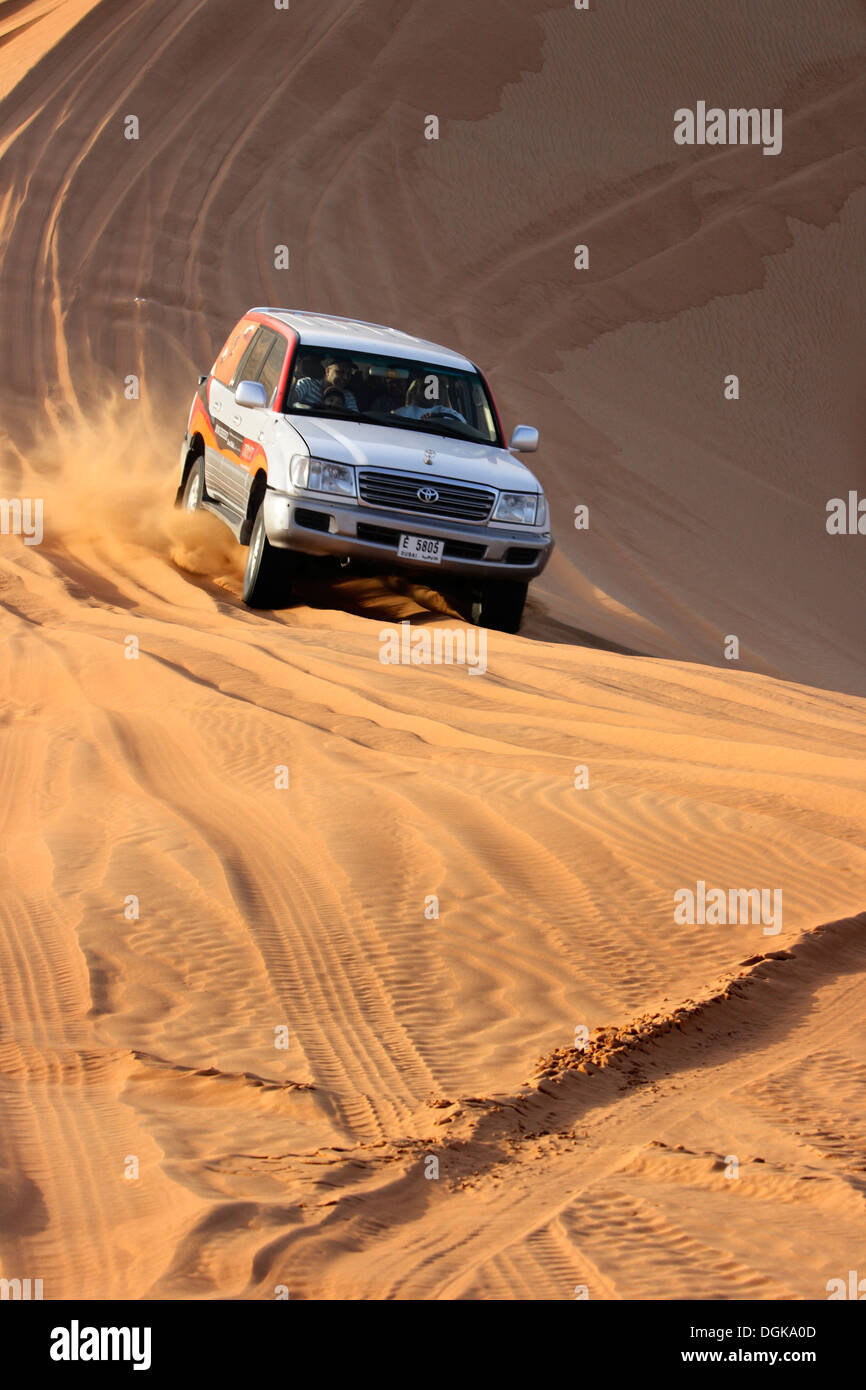 Dune bashing in the Dubai desert Stock Photo - Alamy
