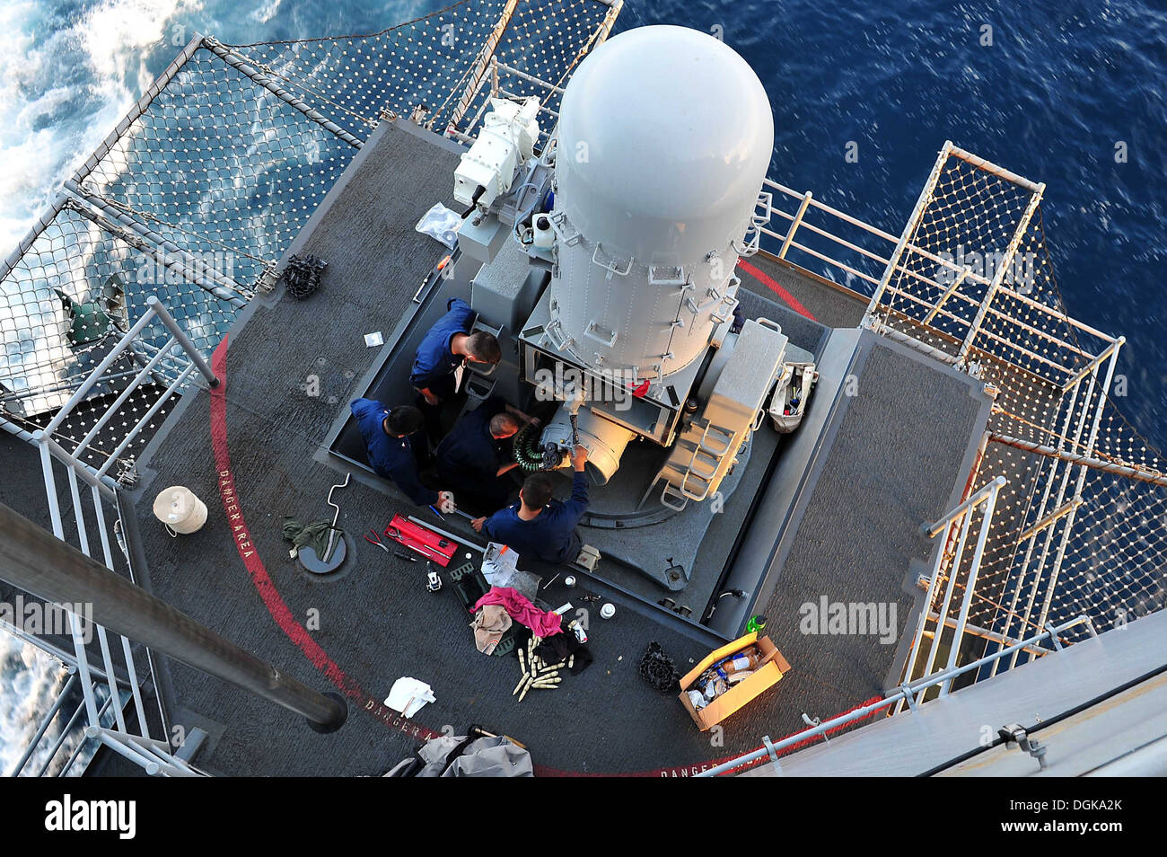 Sailors conduct routine maintenance on a close-in weapons system (CIWS ...