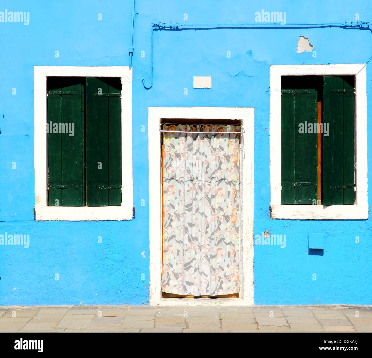 Blue house with closed windows as background.close up Stock Photo - Alamy