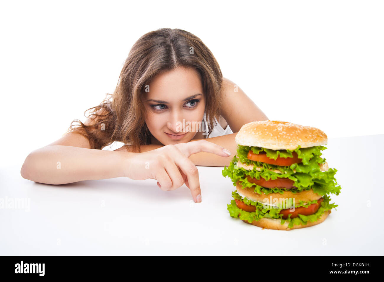 Happy Young Woman Eating big yummy Burger isolated Stock Photo - Alamy