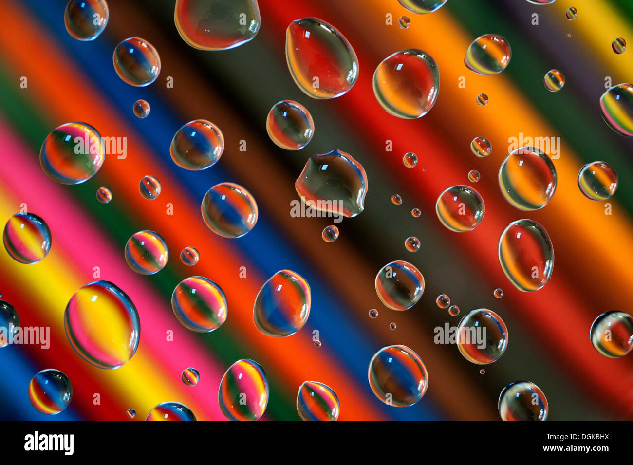 Water drops on colourful stripey background Stock Photo - Alamy