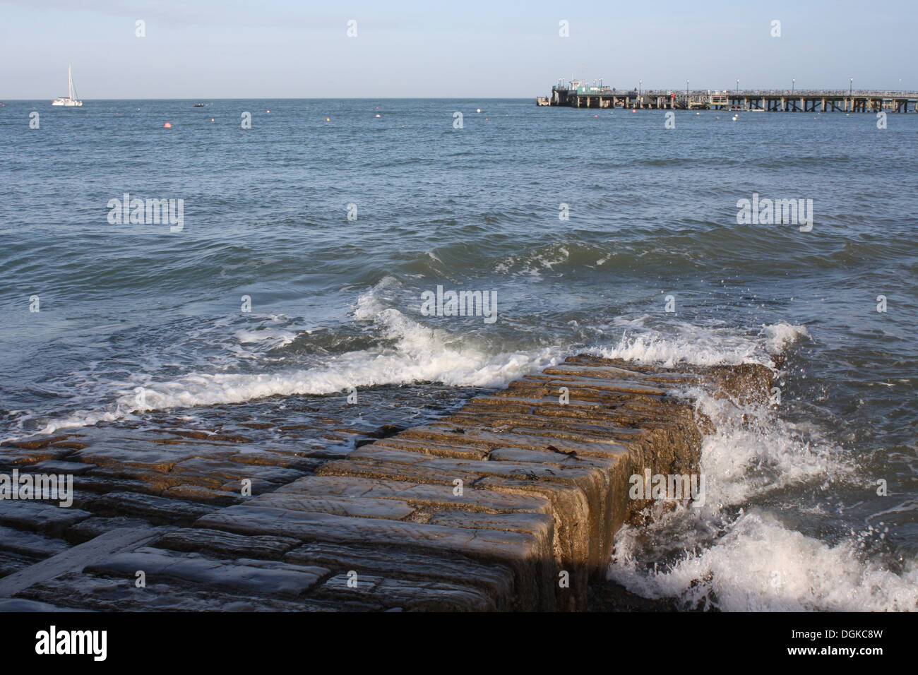 Stone groyne leading off Swanage's oldest stone pier Stock Photo - Alamy