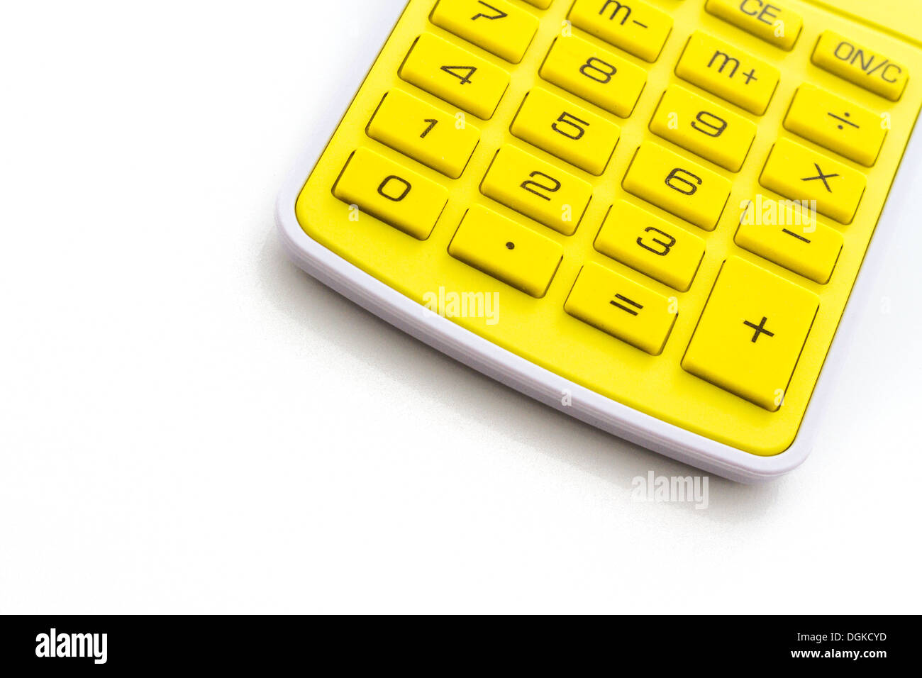 Simple yellow calculator on a white background Stock Photo - Alamy