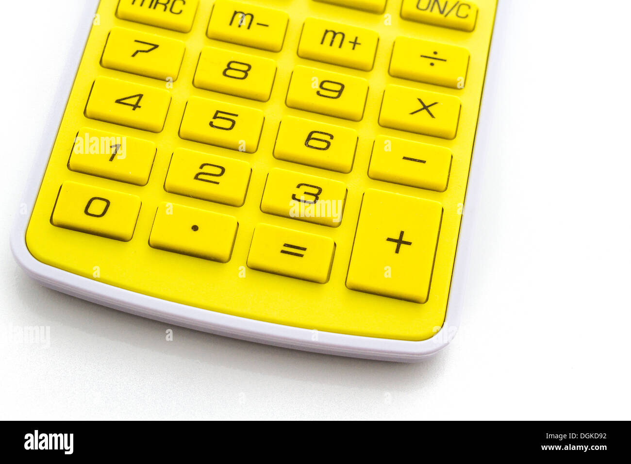 Simple yellow calculator on a white background Stock Photo - Alamy