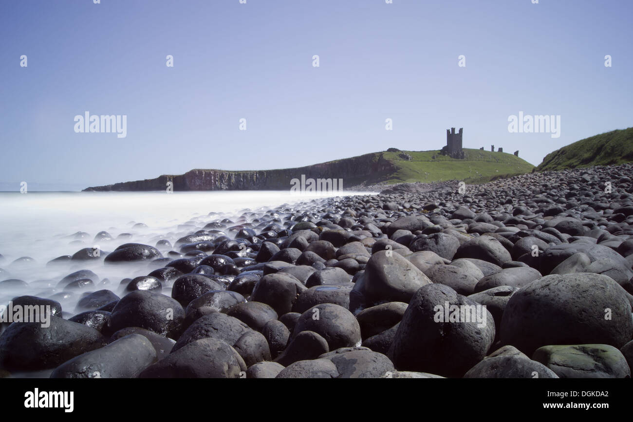 Dunstanburgh Castle from the beach Stock Photo - Alamy