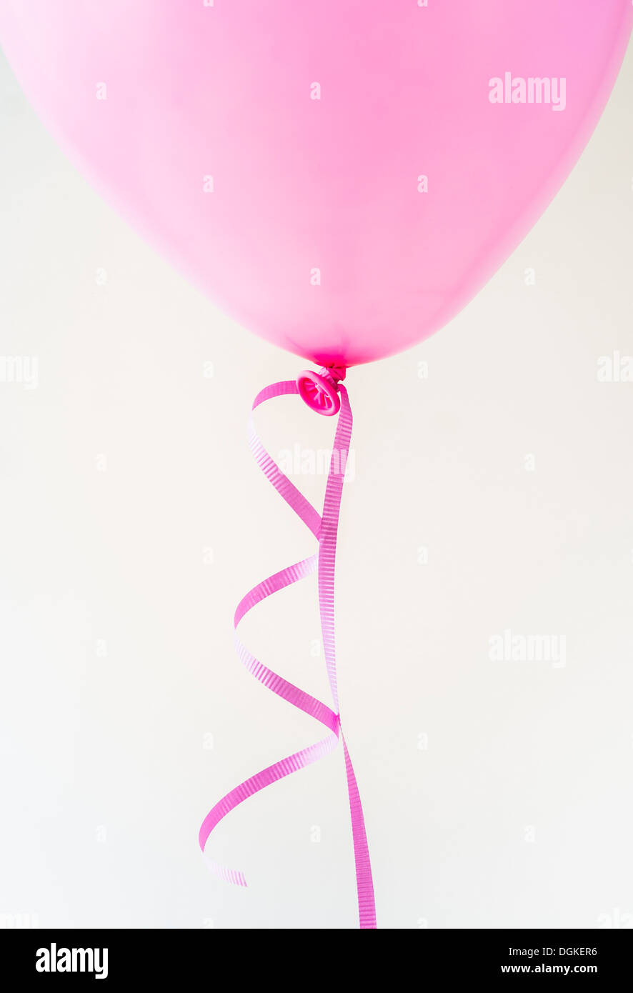 Studio shot of pink balloon Stock Photo - Alamy