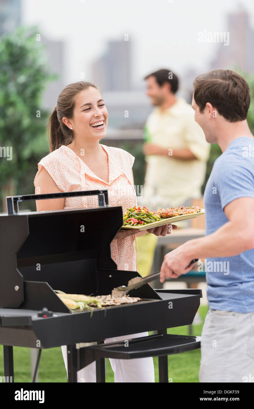 Backyard men friends barbecue hi-res stock photography and images - Alamy