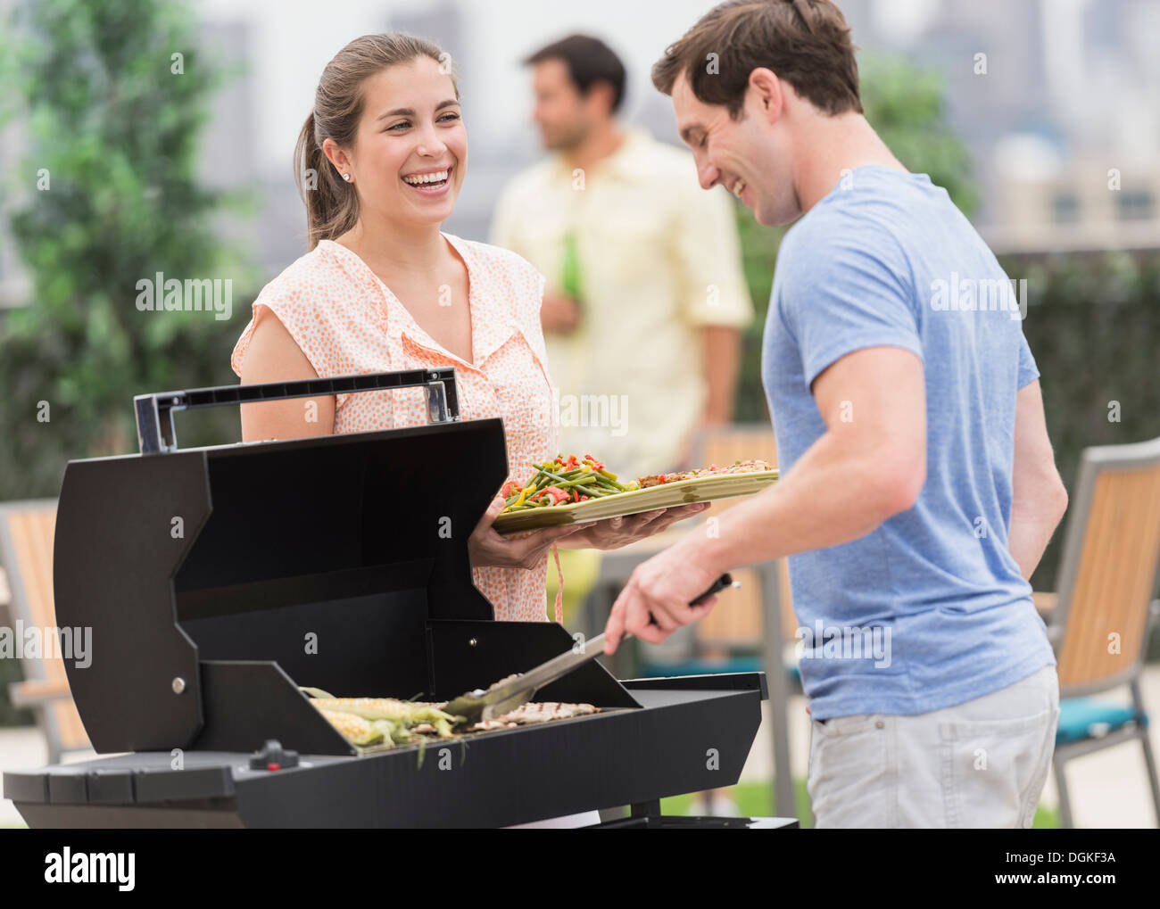 Happy friends barbecue party in hi-res stock photography and images - Alamy