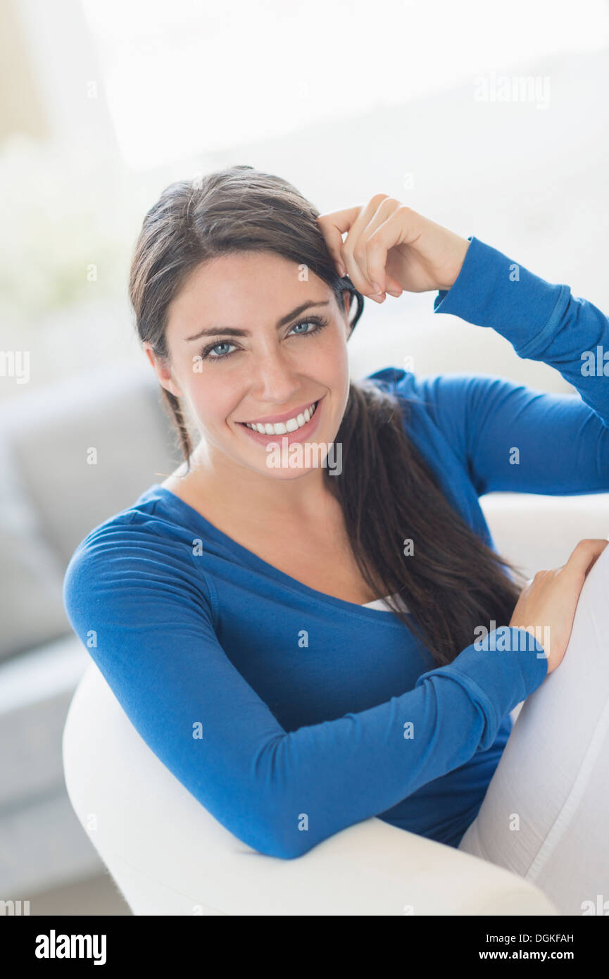 Smiling relaxed young woman hi-res stock photography and images - Alamy