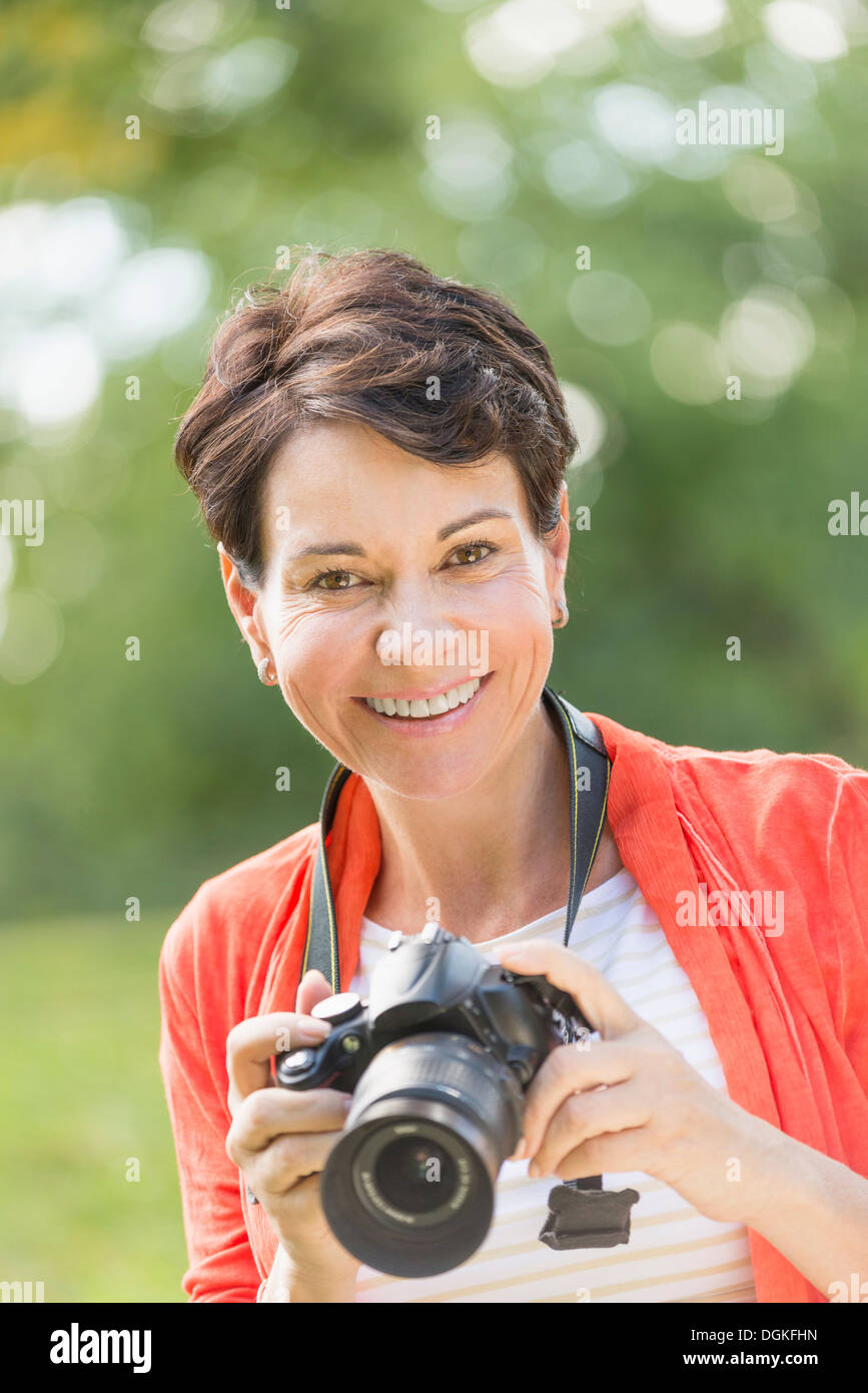 Happy woman camera photographing hi-res stock photography and images ...
