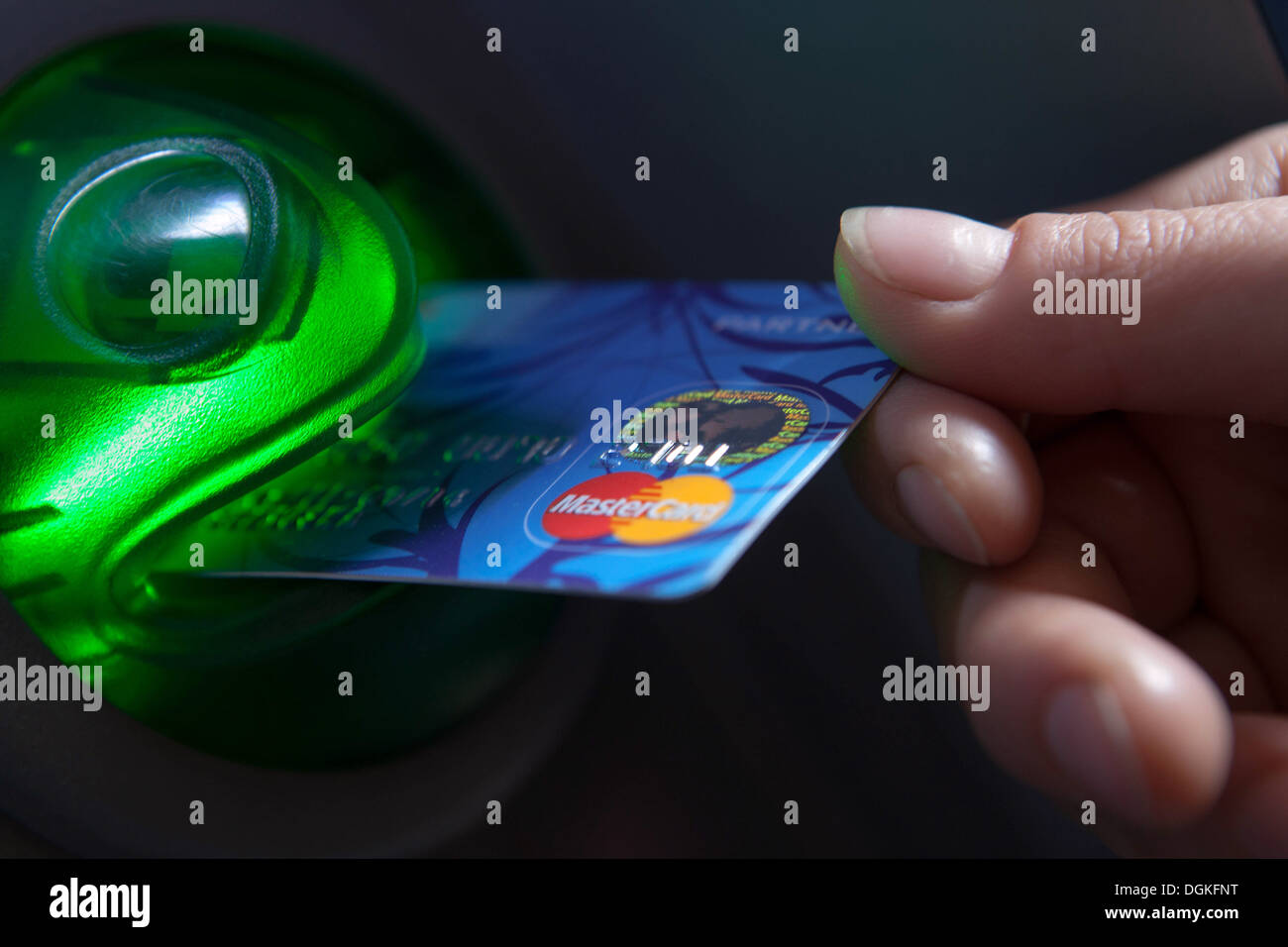 Insert credit card into an ATM machine cash bank teller Stock Photo - Alamy