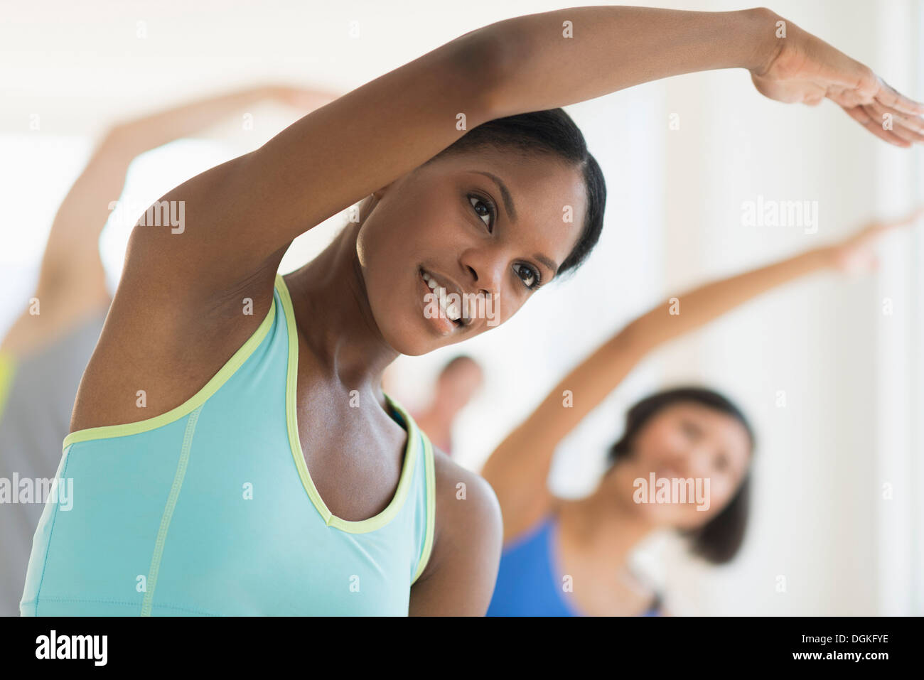 People stretching in gym Stock Photo - Alamy