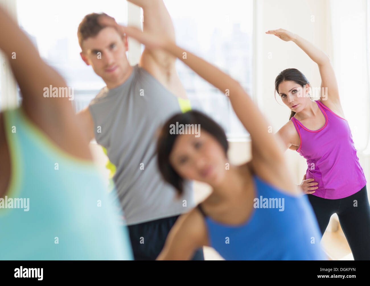 People stretching in gym Stock Photo - Alamy