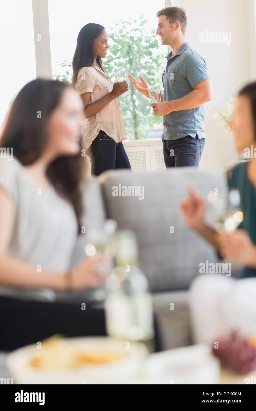 People talking at party Stock Photo - Alamy